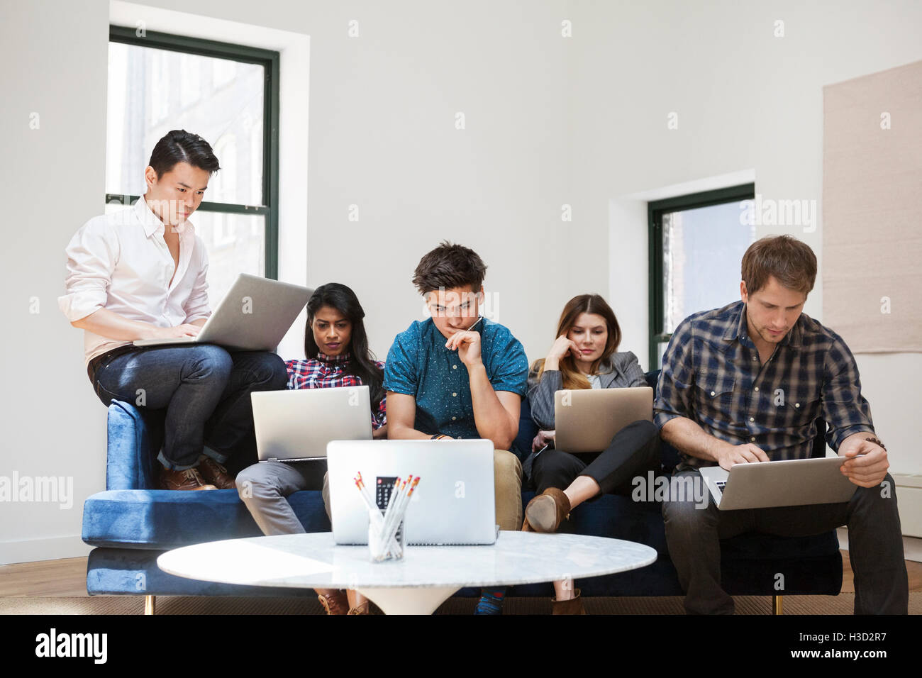 Group working on laptops hi-res stock photography and images - Alamy