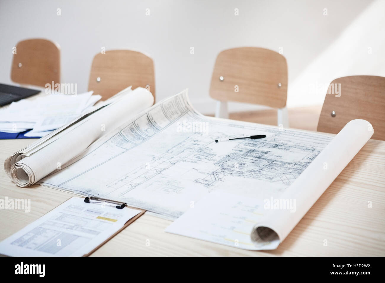 High angle view of blueprints on desk in creative office Stock Photo ...