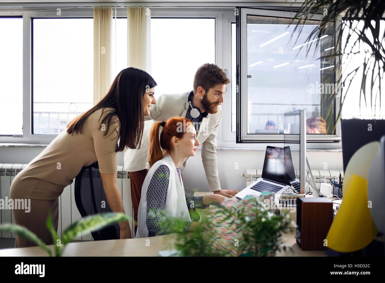 business people using computer in creative office Stock Photo - Alamy