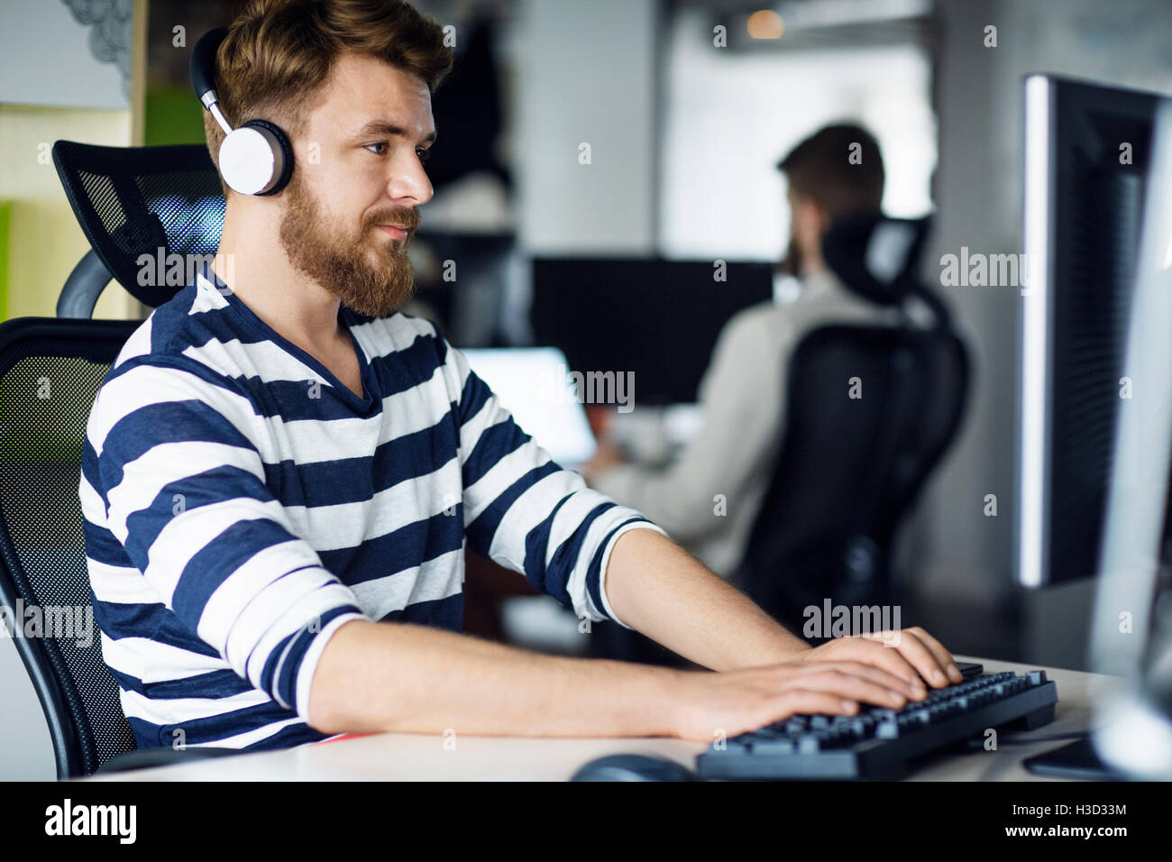 Worker listening music in headphones hi-res stock photography and ...