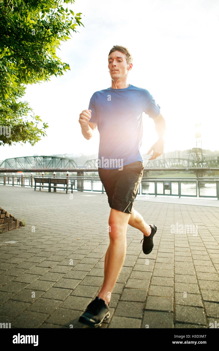 Back view of man jogging in front of hi-res stock photography and ...