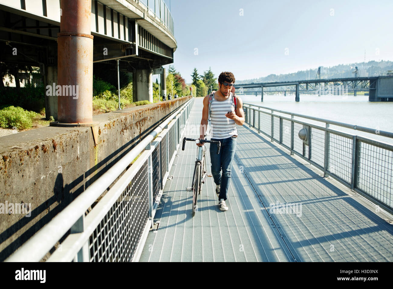 Walking with bicycle hi-res stock photography and images - Alamy