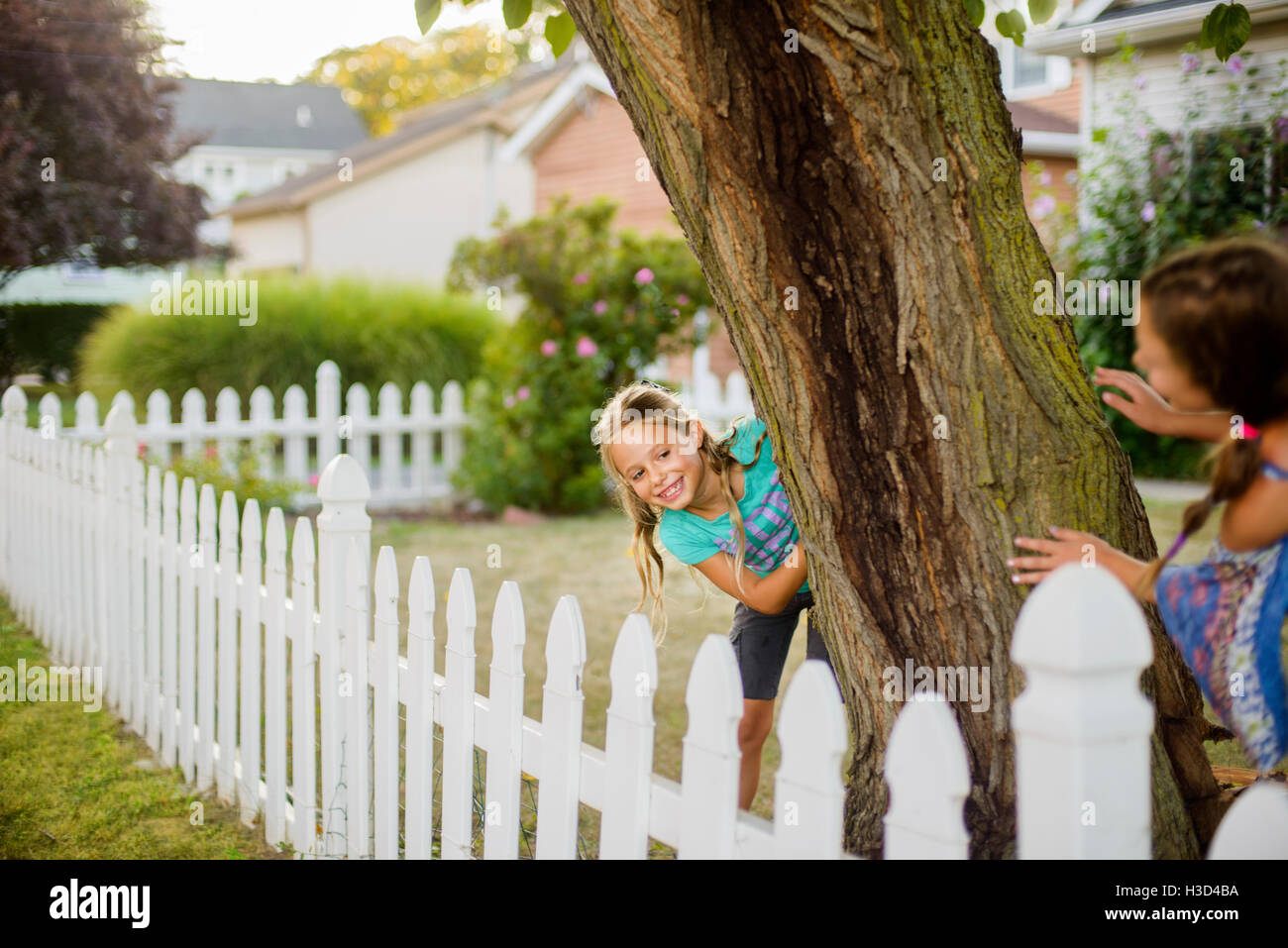 Sisters playing hide seek in hi-res stock photography and images - Alamy