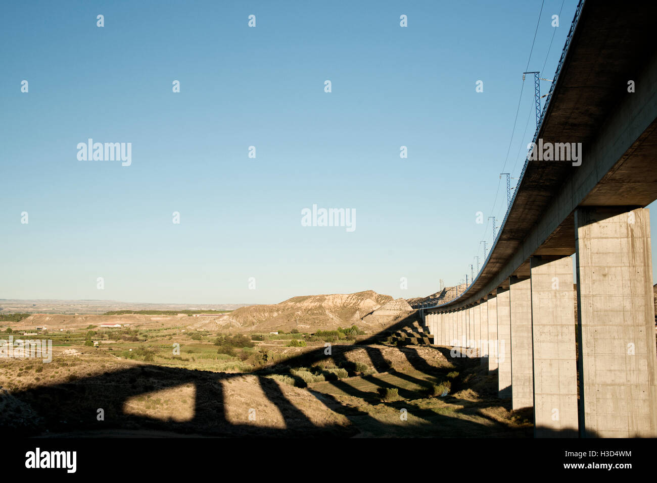 High Speed train rail over landscape against clear blue sky Stock Photo ...
