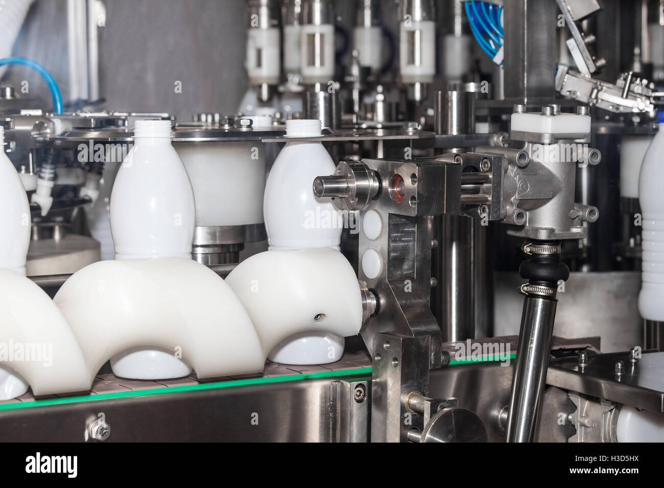 Packaging milk bottles line Stock Photo - Alamy