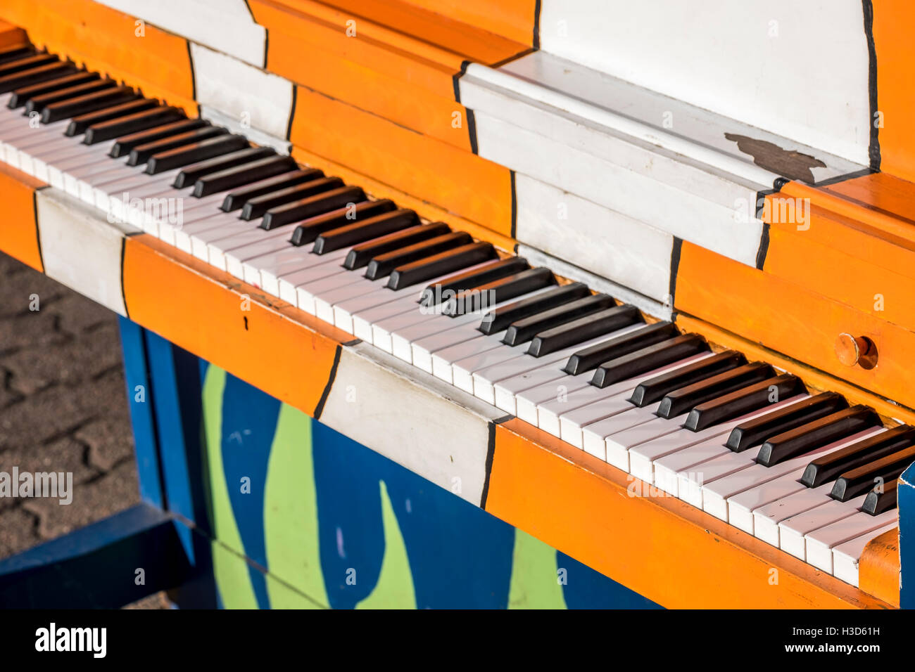 A keyboard on a colorfully painted piano Stock Photo - Alamy