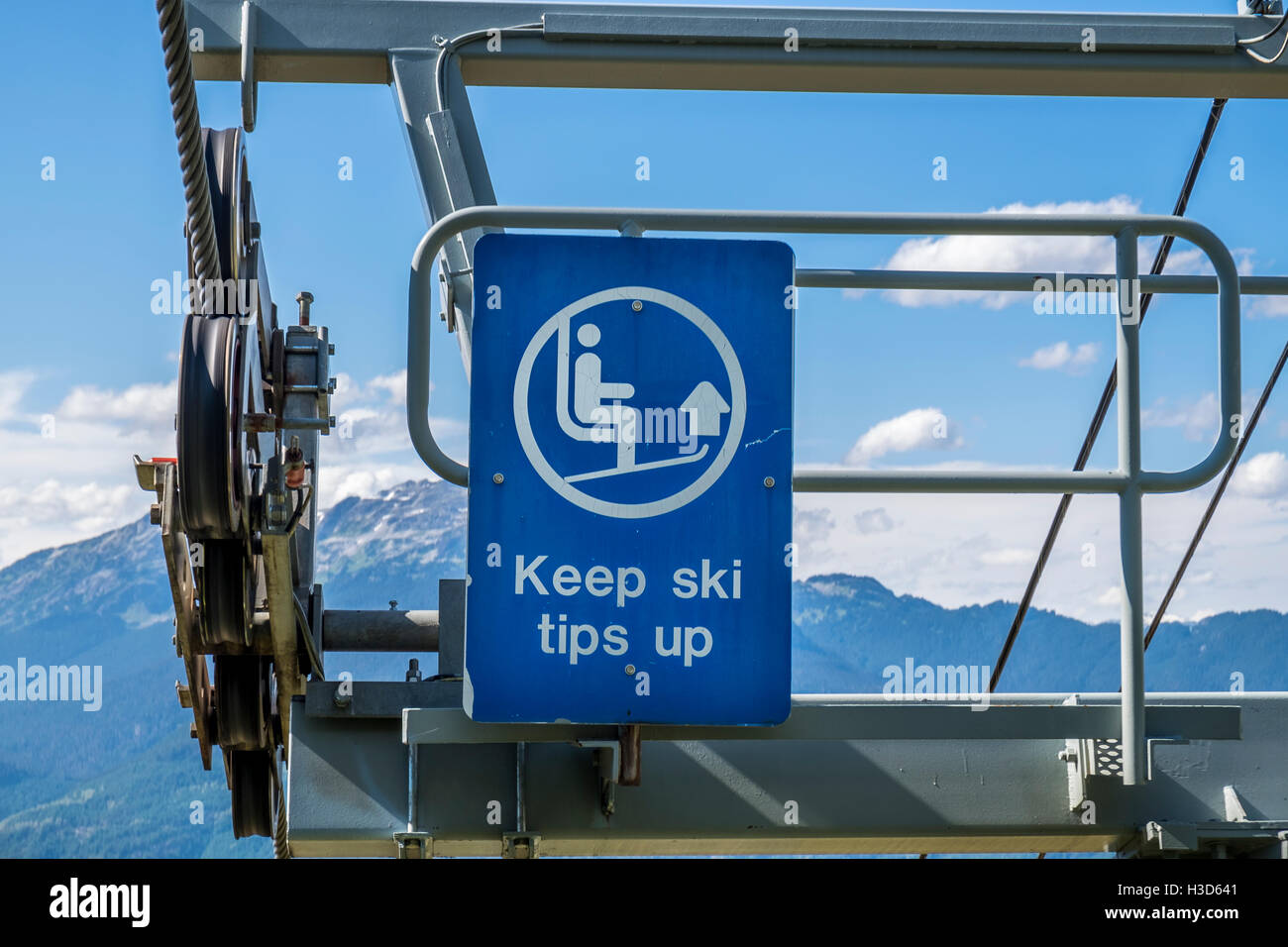 A sign warns skiers to keep ski tips up as they exit the chair lift ...