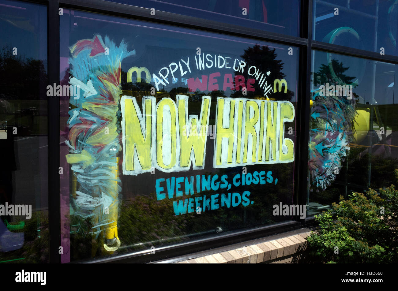 Large colorful graphic now hiring sign on McDonald's Restaurant window ...
