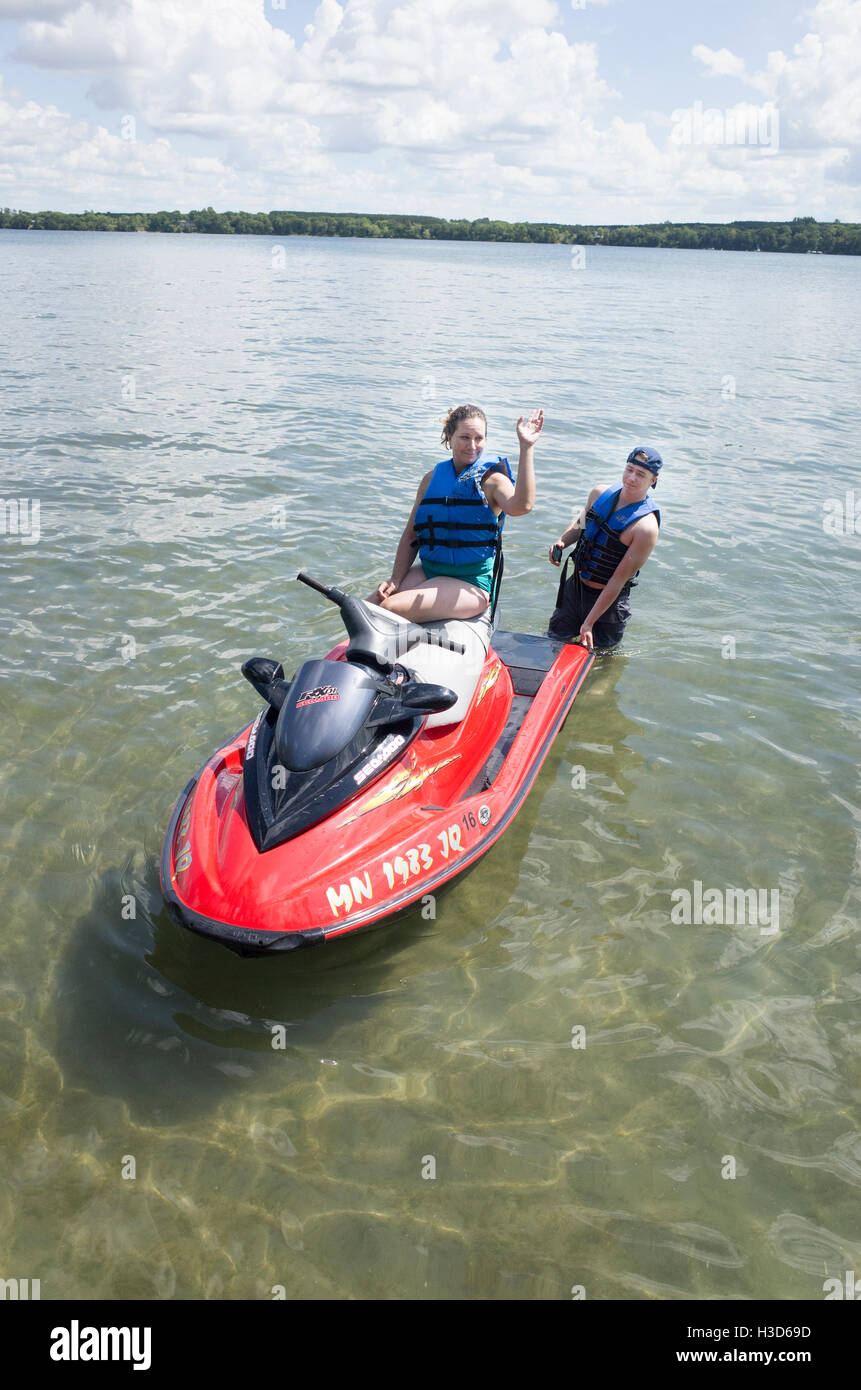 Mom gives a royalty wave after a successful run on the Sea-Doo with her ...