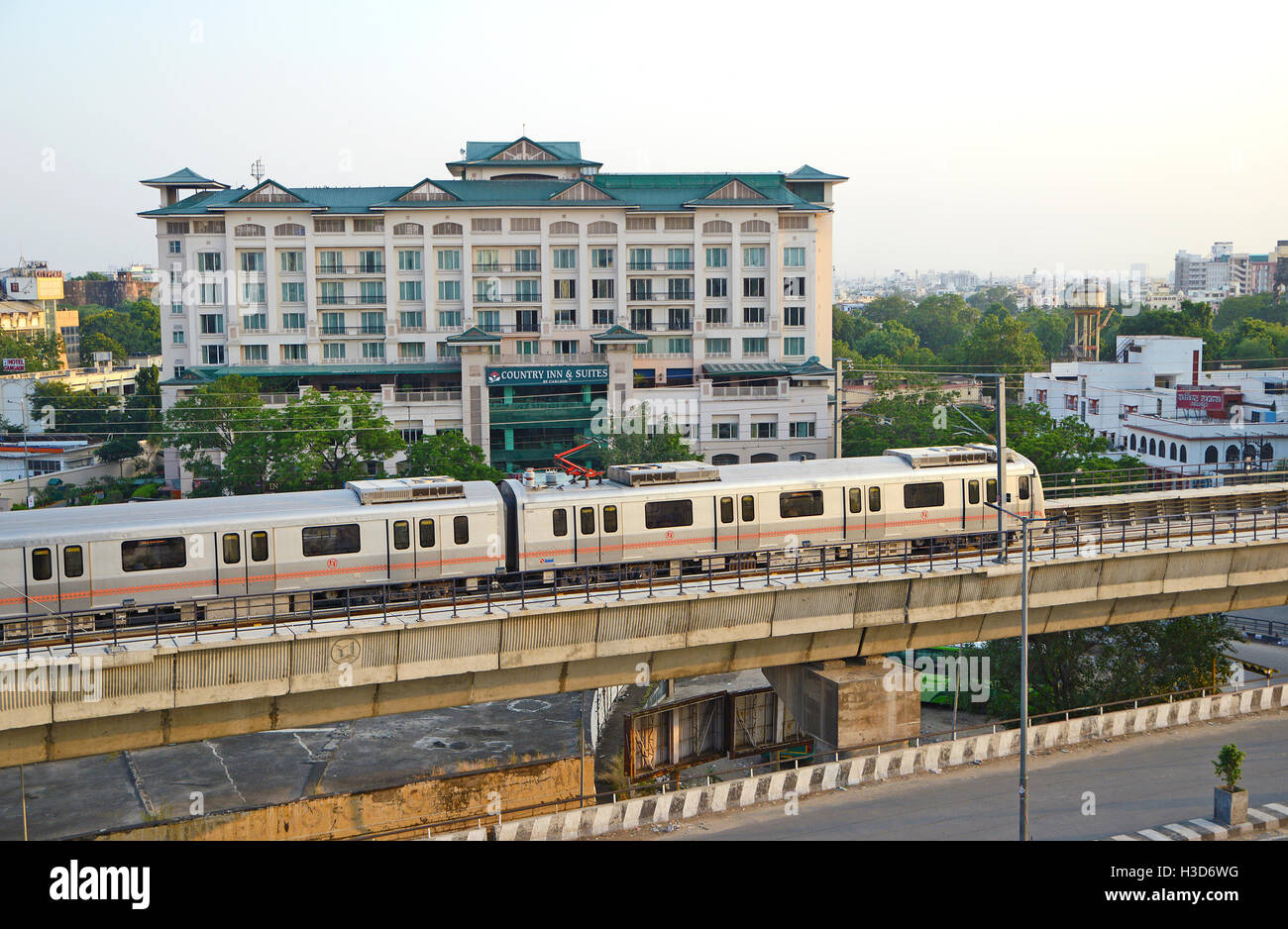 Electric train in city Stock Photo - Alamy