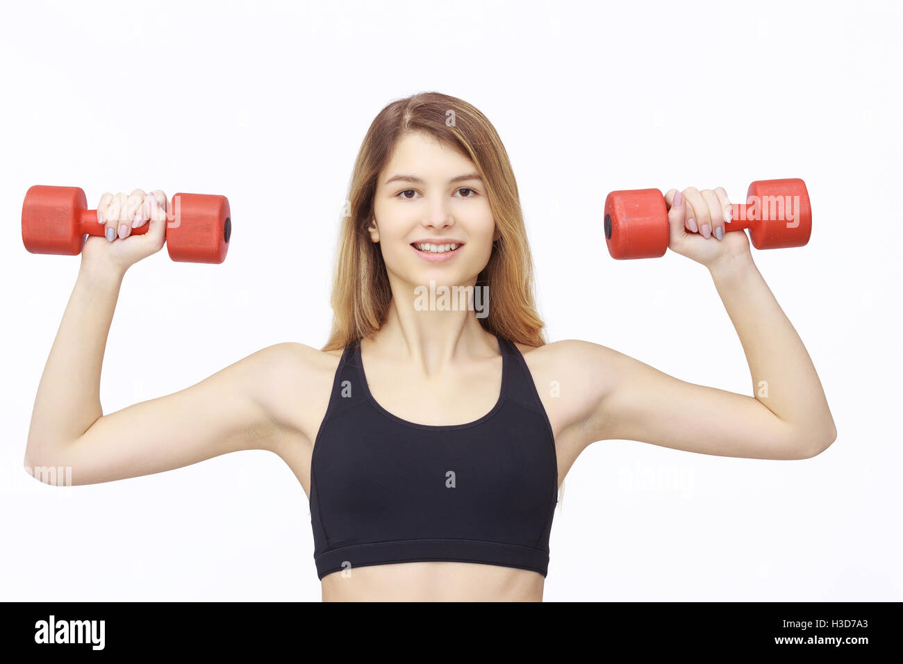 Young woman with dumbbells hi-res stock photography and images - Alamy