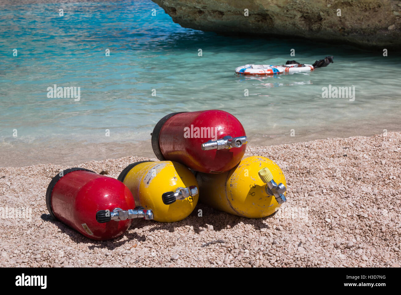 Colorful Scuba Oxygen Tanks for Divers on a Beach Stock Photo - Alamy