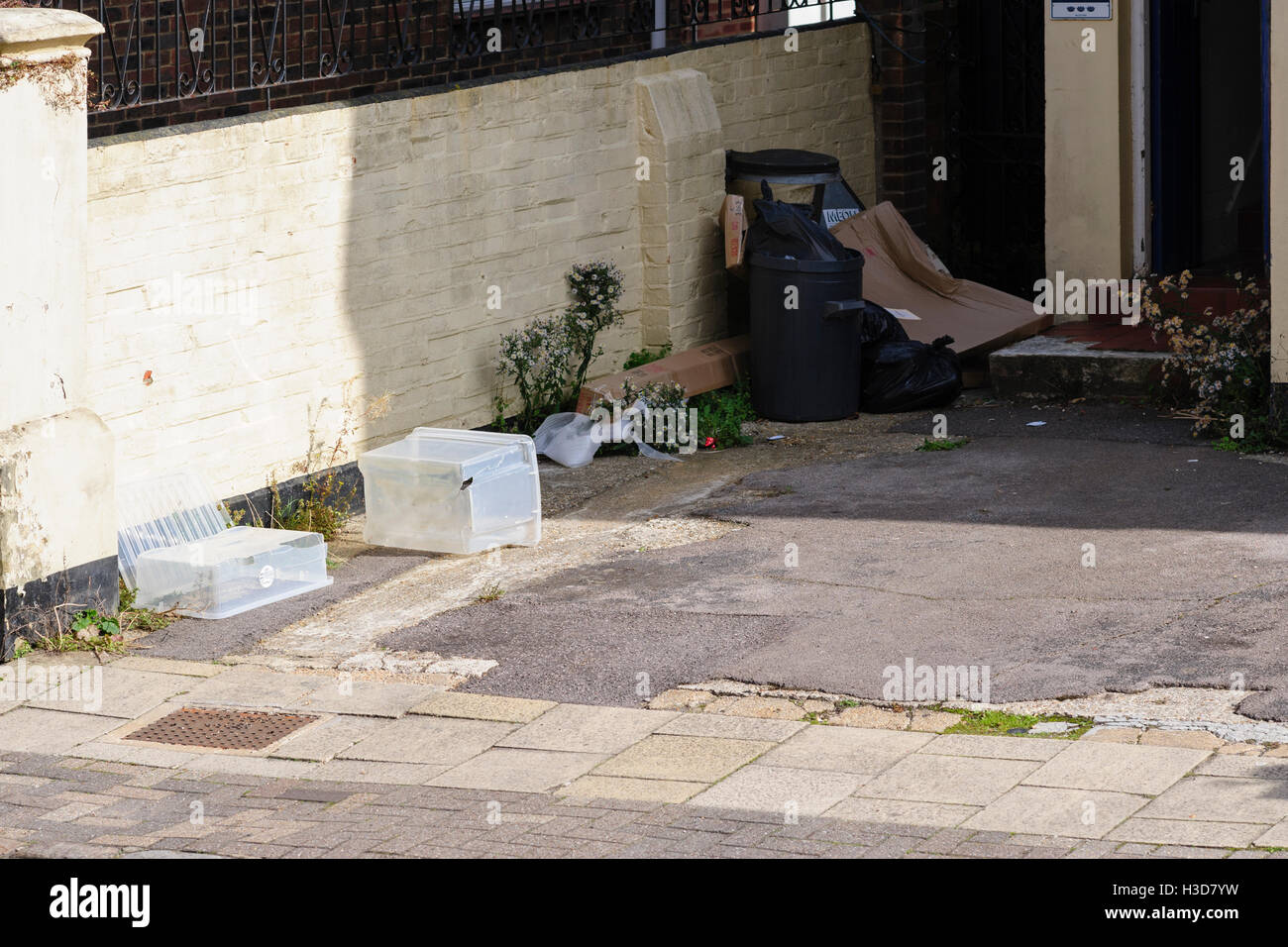 untidy house forecourt littered with garbage awaiting collection uk ...