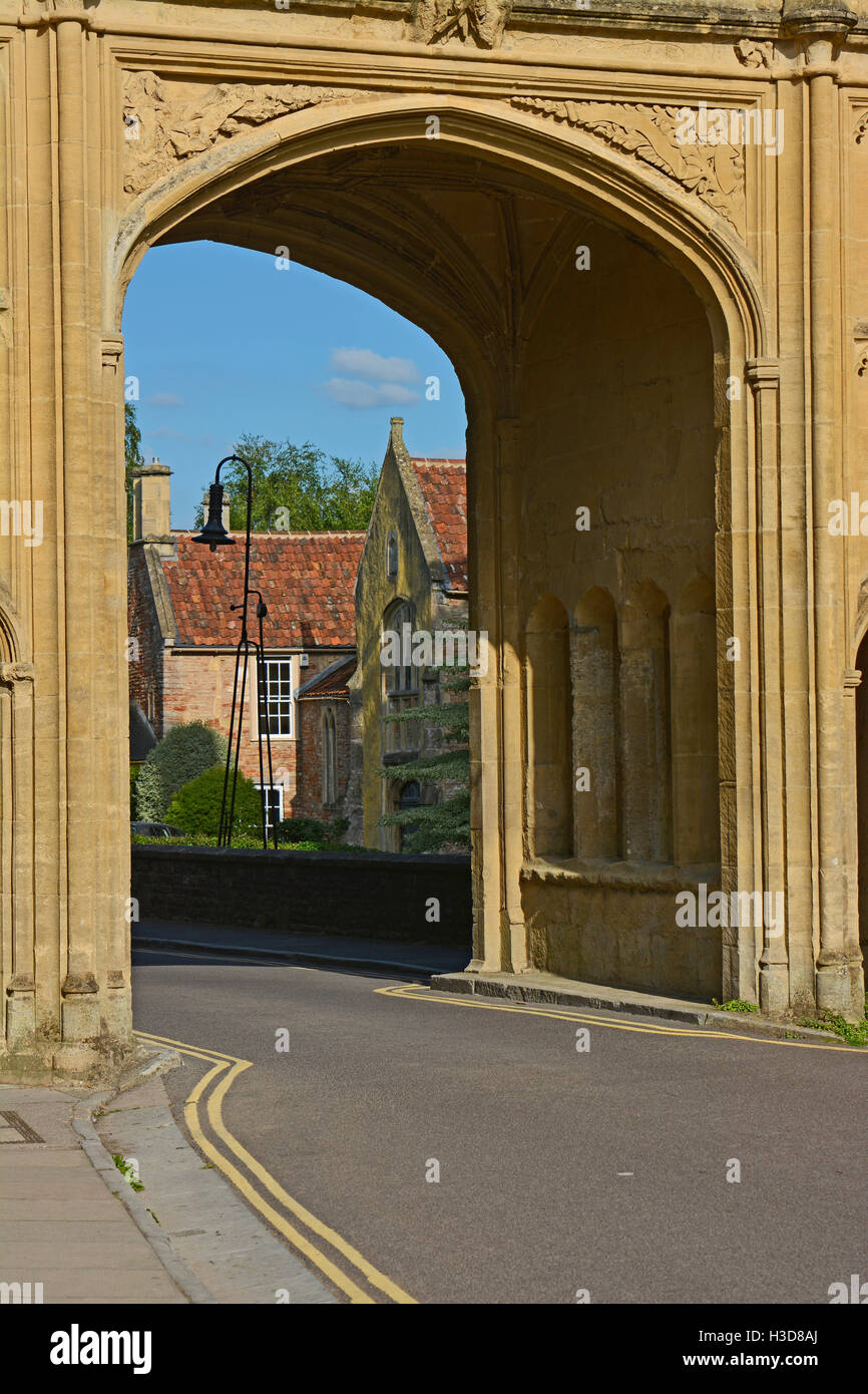 Road under archway at side of Wells Cathedral, Somerset, England Stock ...