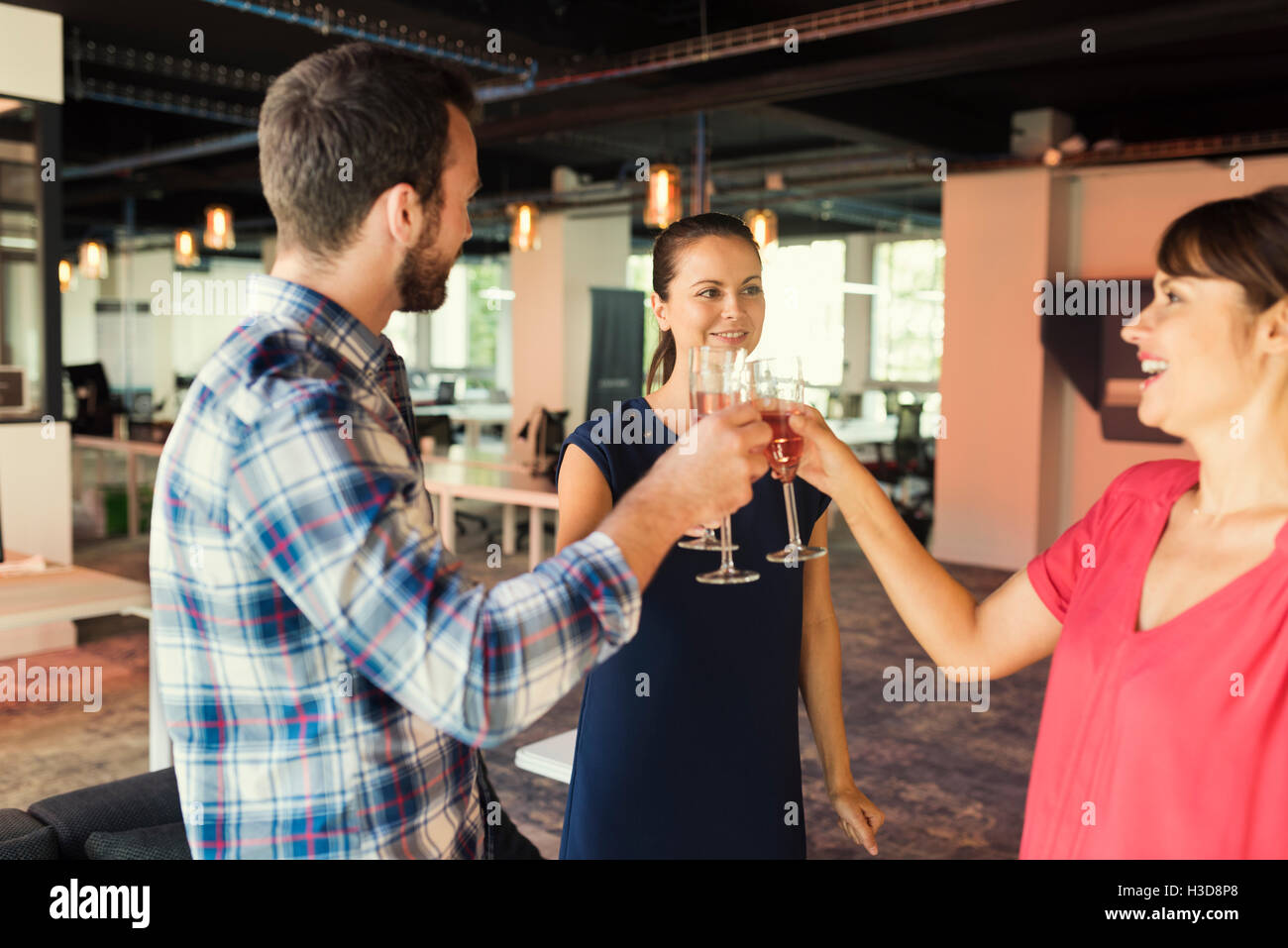 Successful business team toasting with flutes of champagne. Modern ...