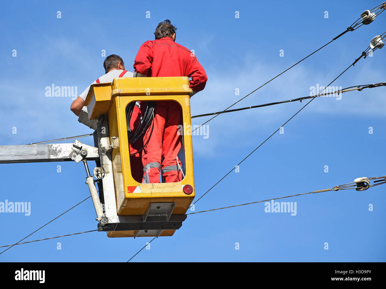 Electricians are working in height Stock Photo - Alamy