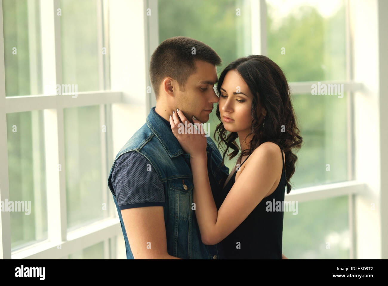 Romantic couple hugging Stock Photo - Alamy