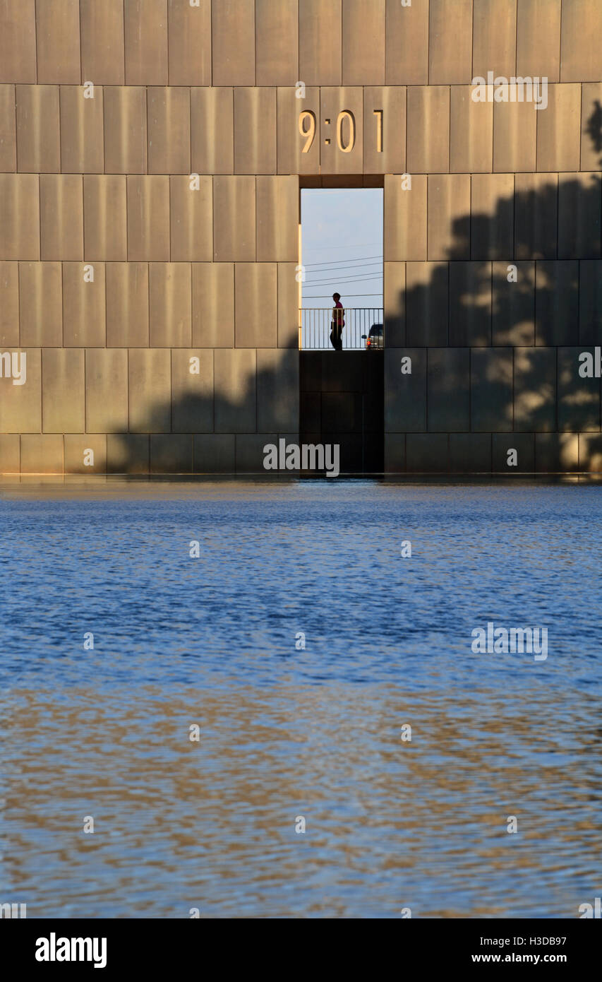 Two gates at the Oklahoma City National Memorial mark before (9:01) and ...