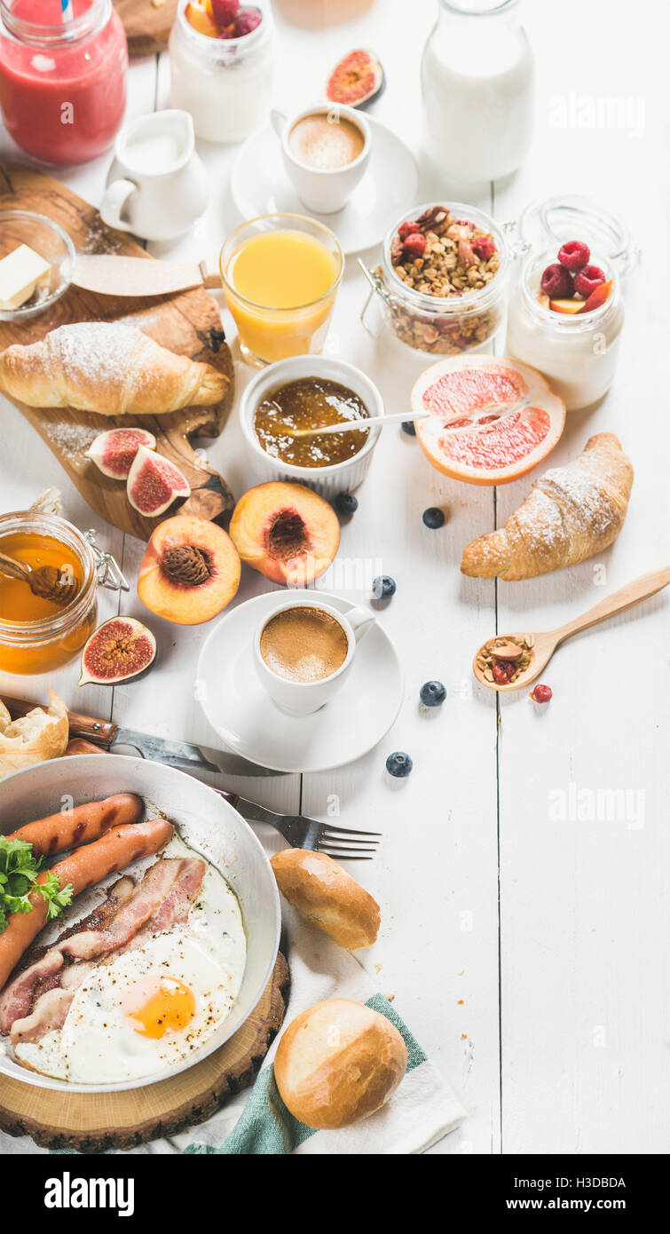 Breakfast snacks and drinks set on white wooden background Stock Photo ...