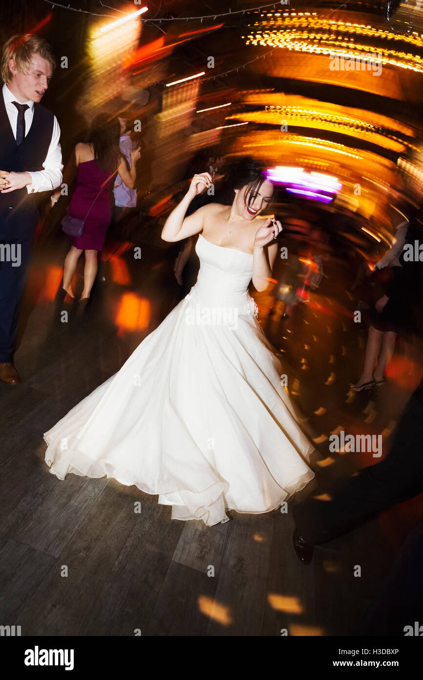 A bride dancing at her wedding party Stock Photo - Alamy