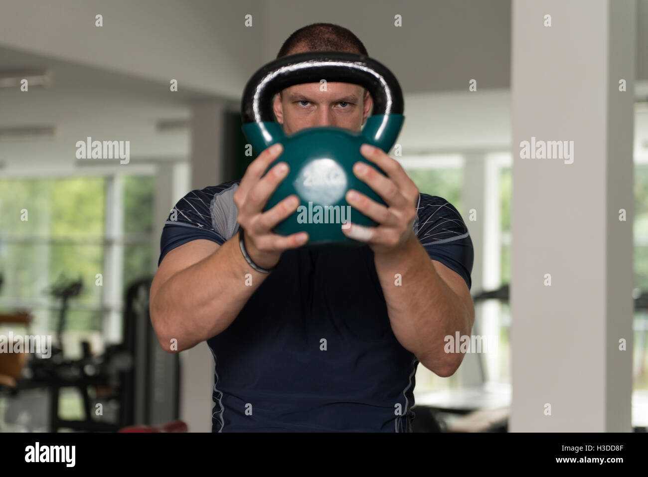 Man Working Out With Kettle Bell In A Gym - Bodybuilder Doing Heavy ...