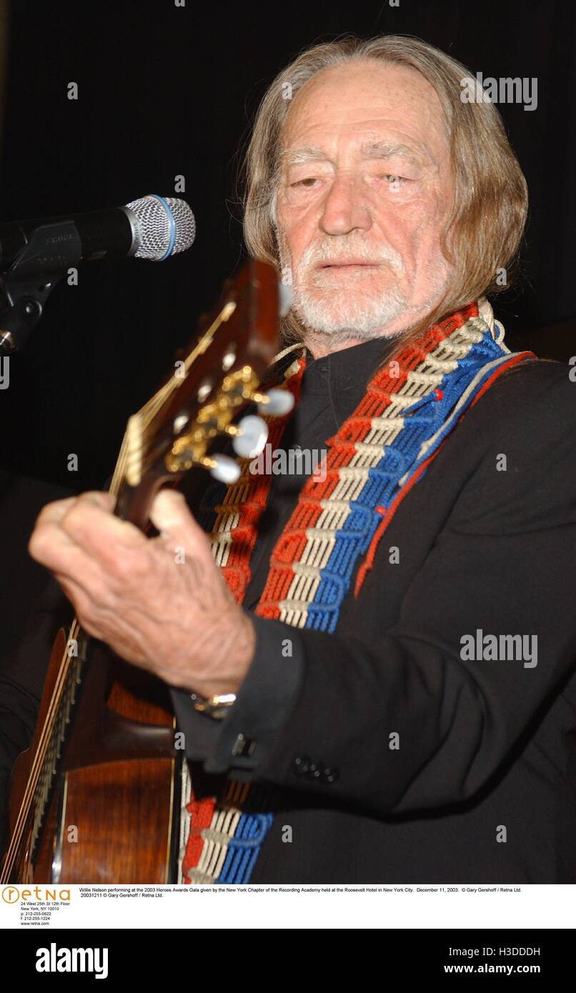 Willie Nelson performing at the 2003 Heroes Awards Gala given by the ...