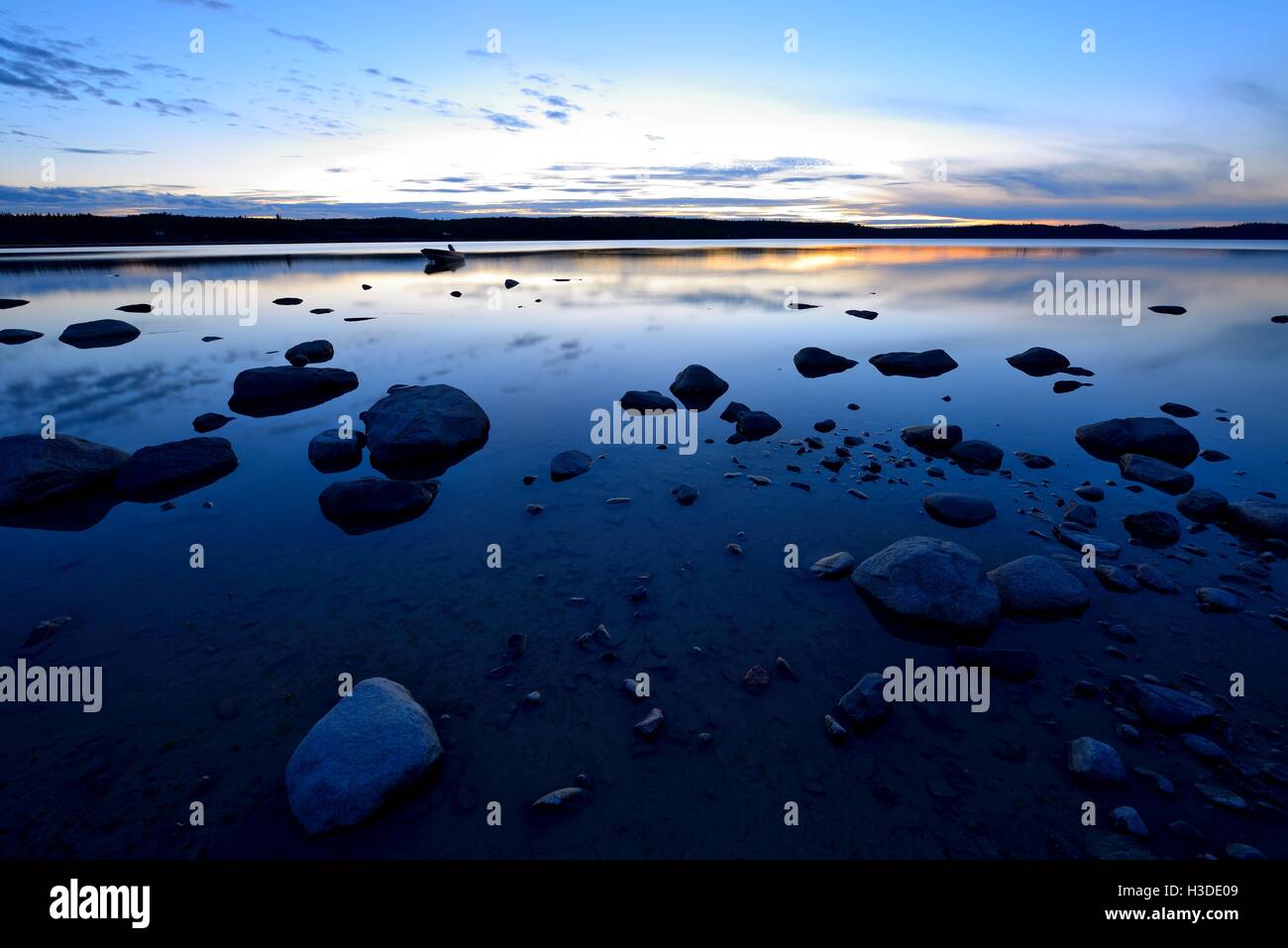 Sunset at Blue Rocky Lake - The sun sets at a northern rocky lake ...
