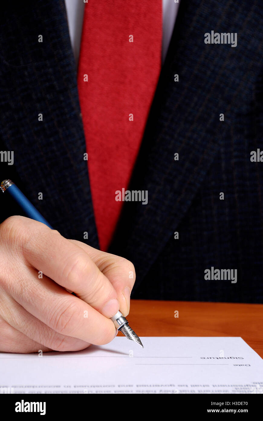 man in suit signing a contract Stock Photo - Alamy