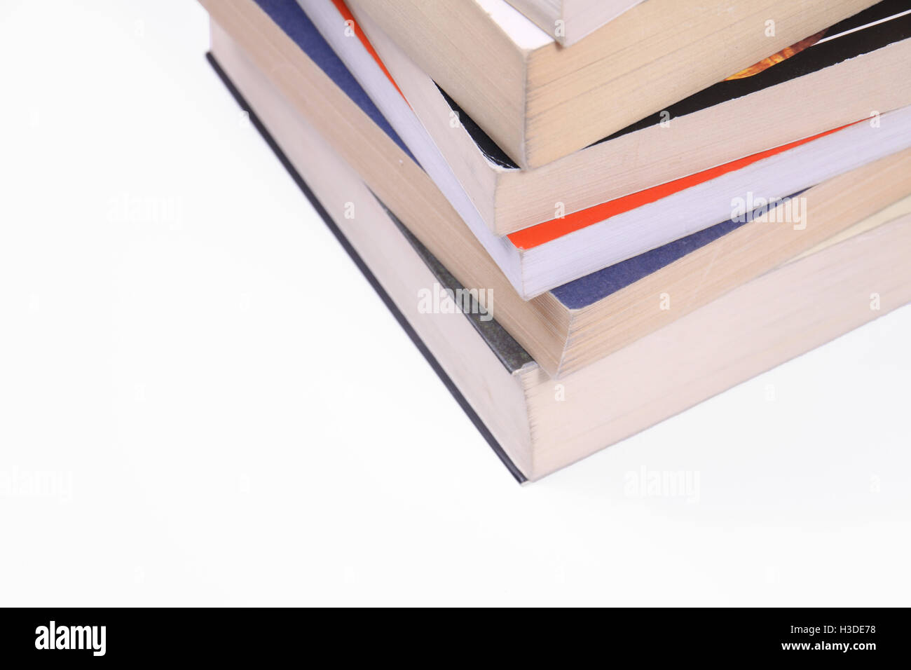 Pile of books on white background isolated Stock Photo - Alamy