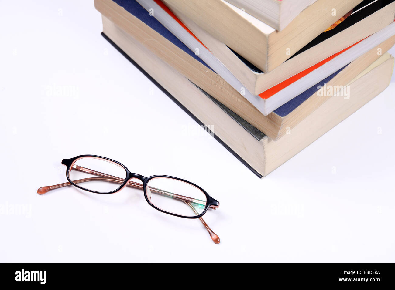 Pile of books on white background isolated Stock Photo - Alamy