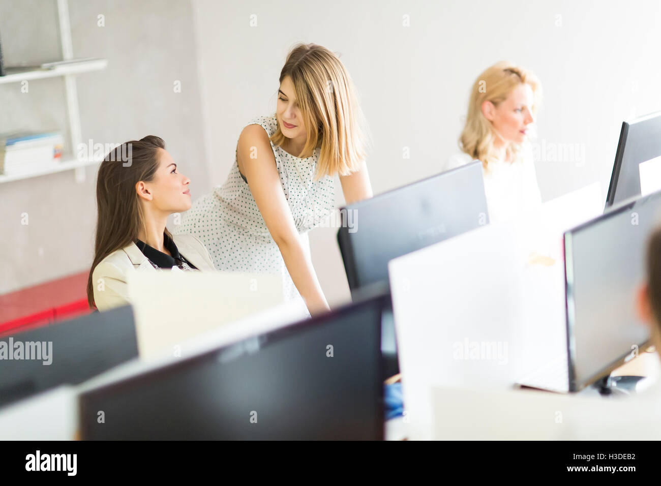 Young women working in the modern office Stock Photo - Alamy