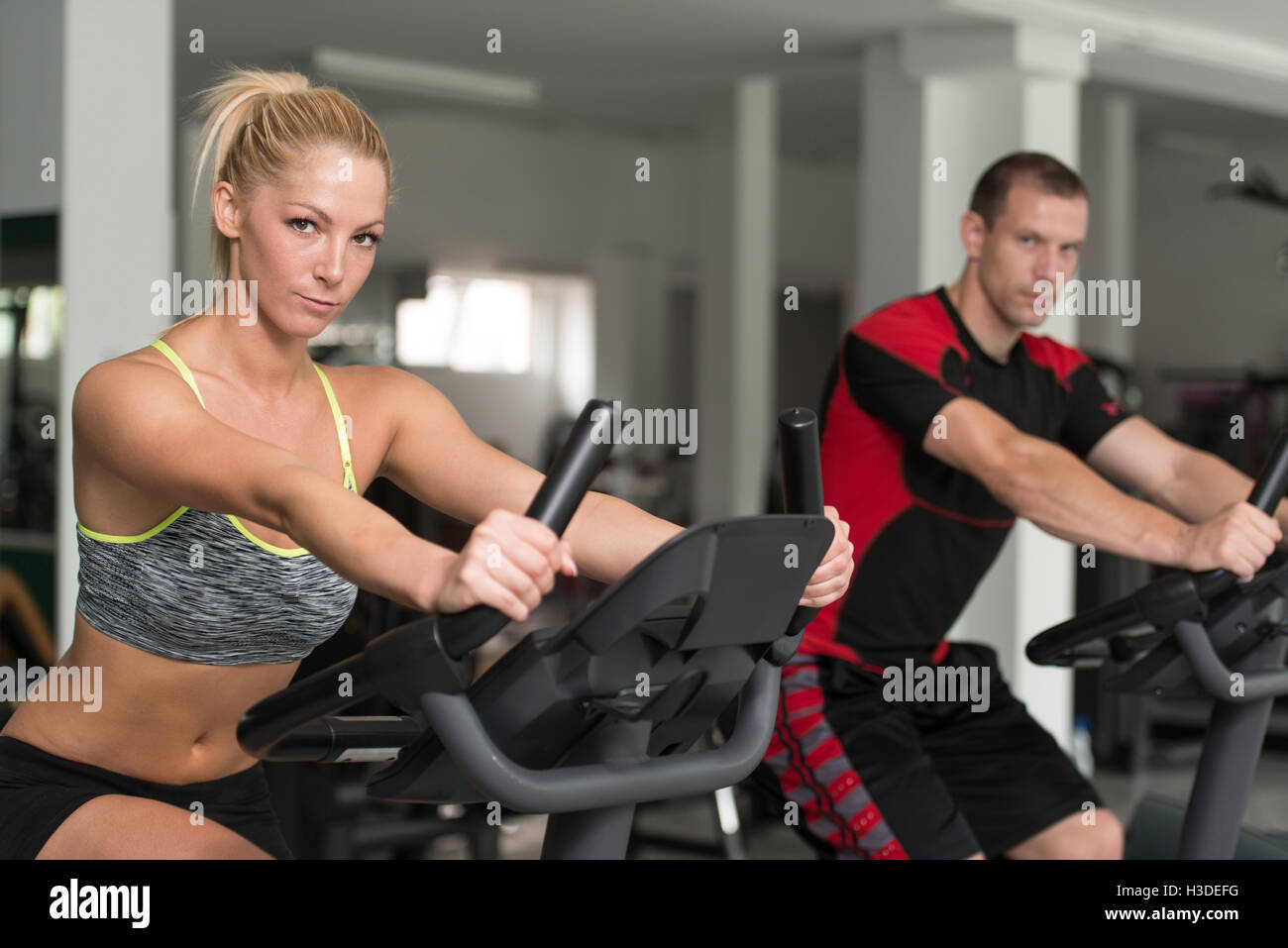 Exercise bike fitness girl hi-res stock photography and images - Alamy