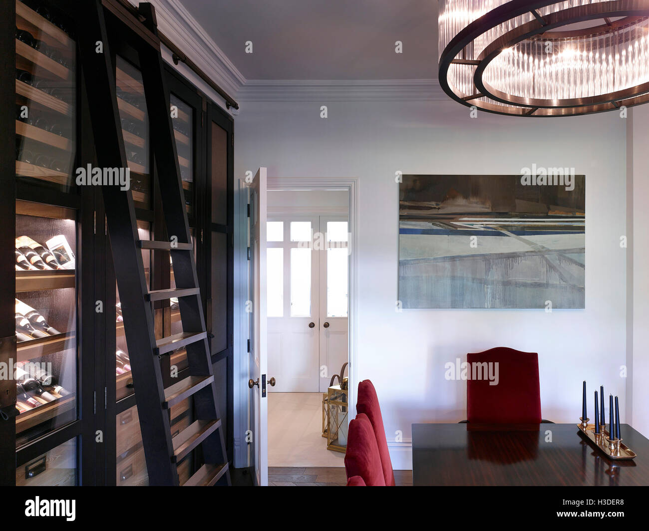 Dining room with wine storage. Putney House, LONDON, United Kingdom ...