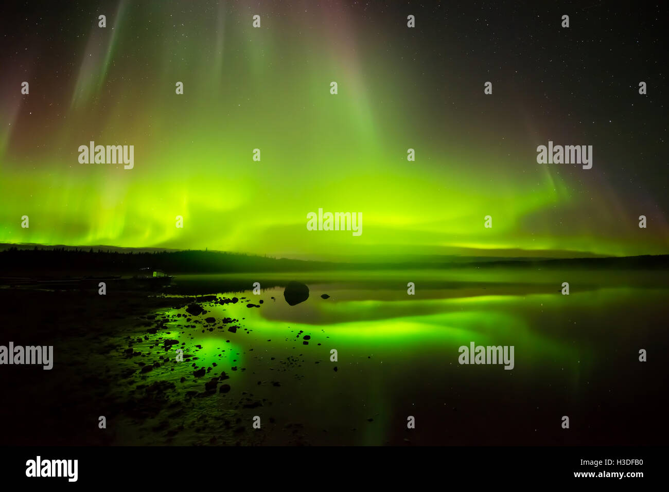 Rolling Lights - Layers of bright rolling northern lights reflecting in ...