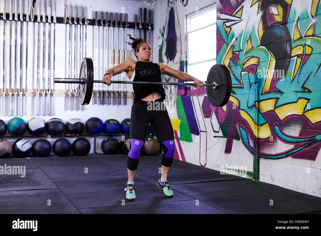 A female athlete trains in a crossfit gym Stock Photo - Alamy