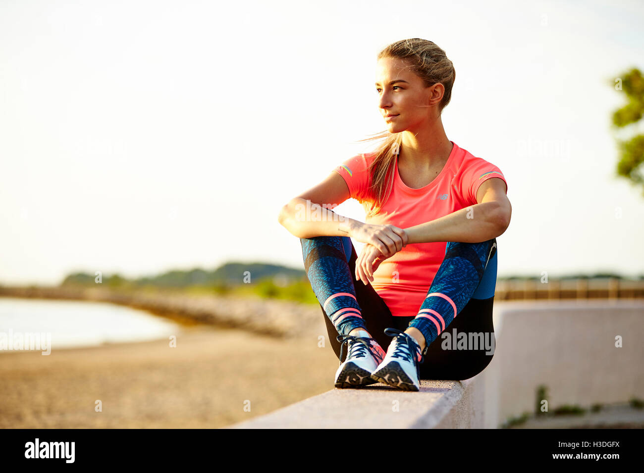 A young athletic woman stretches Stock Photo - Alamy