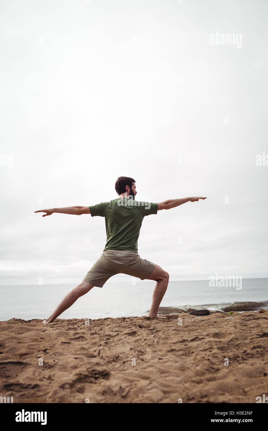 Man performing stretching exercise Stock Photo - Alamy