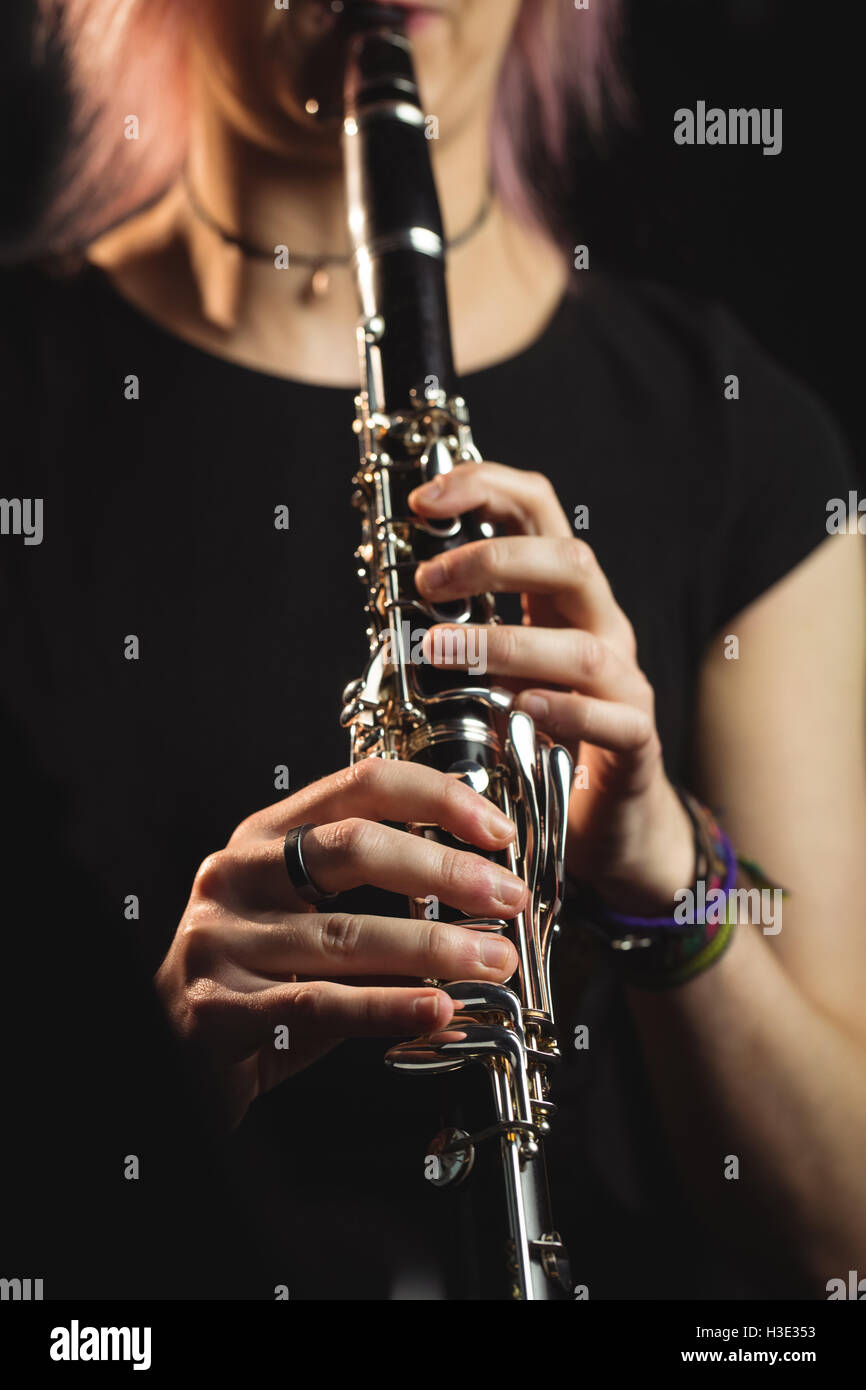 Adult woman female musician playing clarinet hi-res stock photography ...