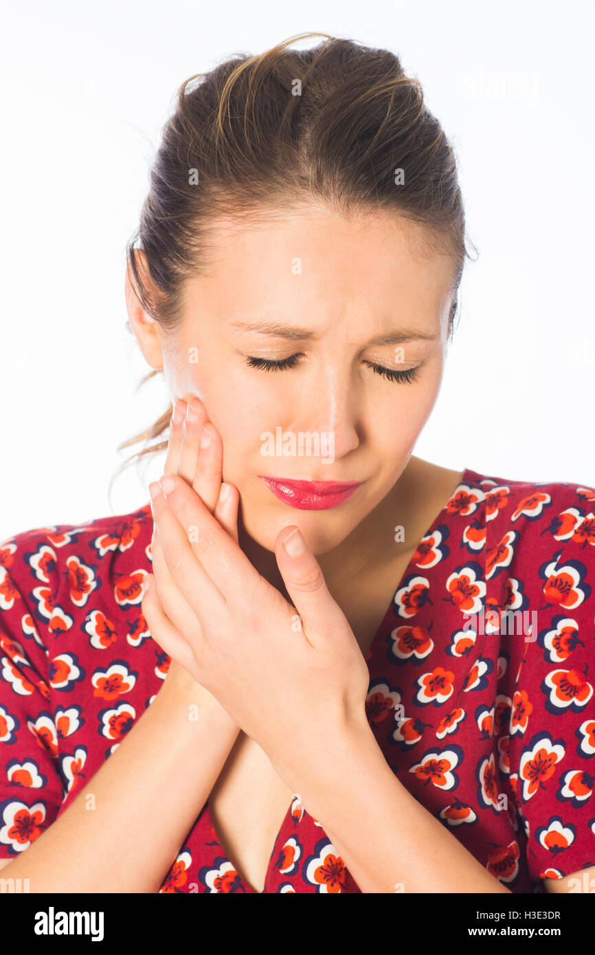 Young woman suffering sever pain against a white background Stock Photo ...