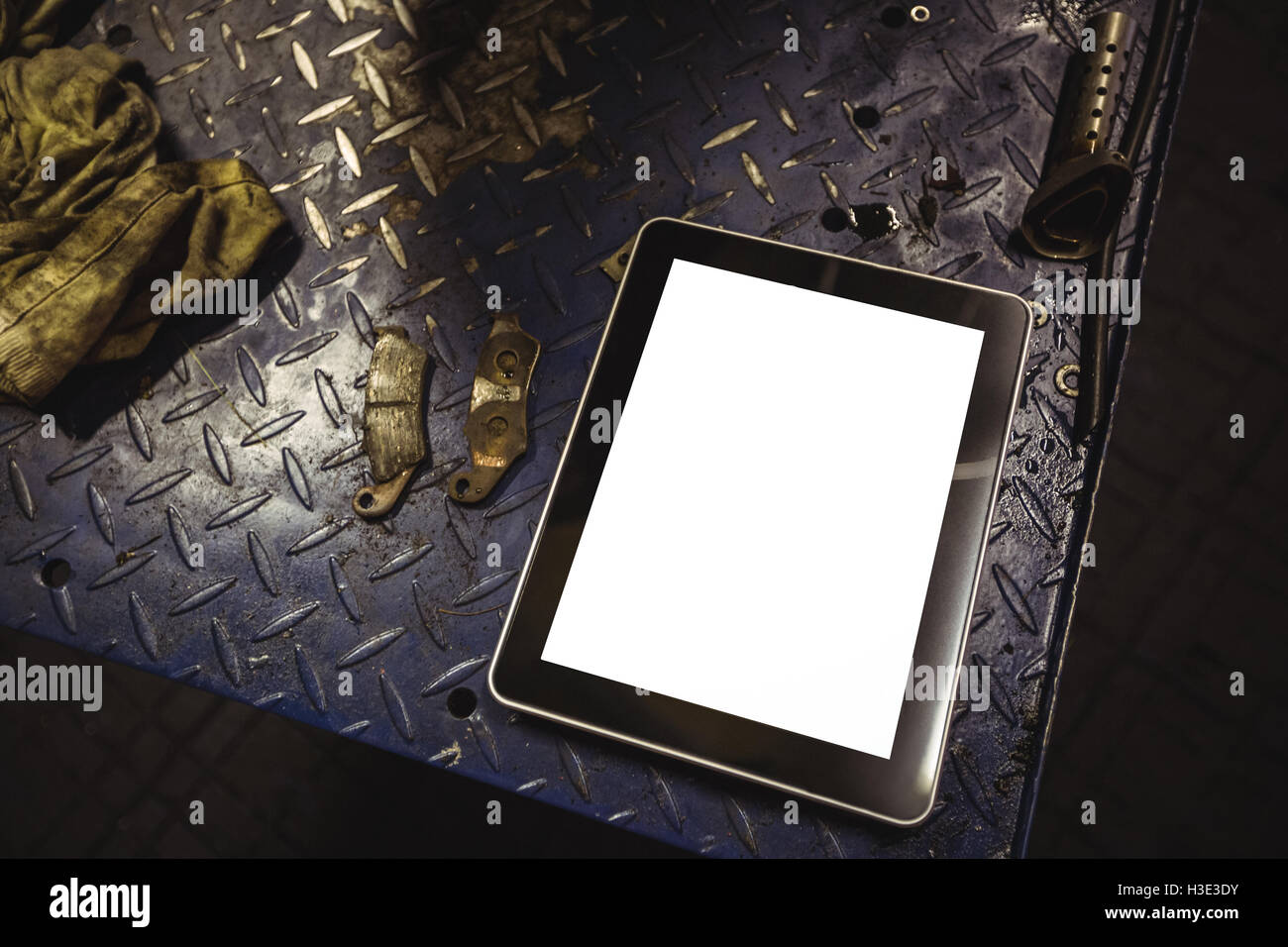 Digital tablet on workbench Stock Photo - Alamy