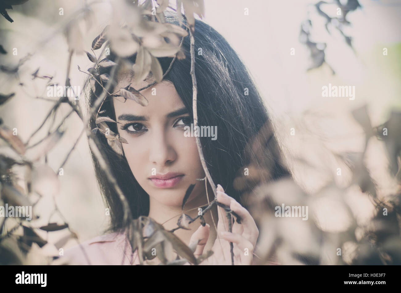 Beautiful young woman staring outdoors Stock Photo - Alamy