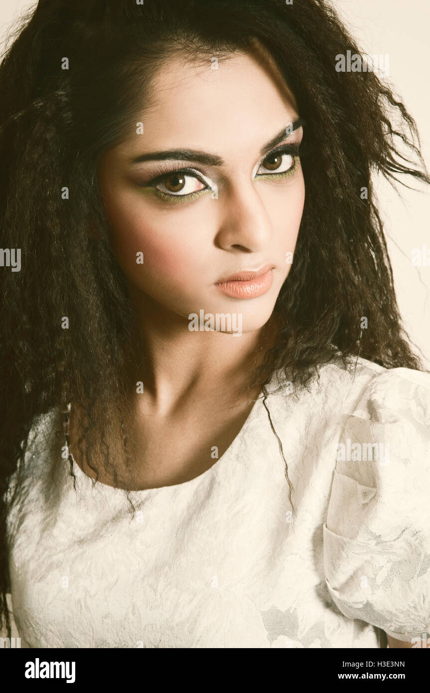 Beautiful young woman staring Stock Photo - Alamy