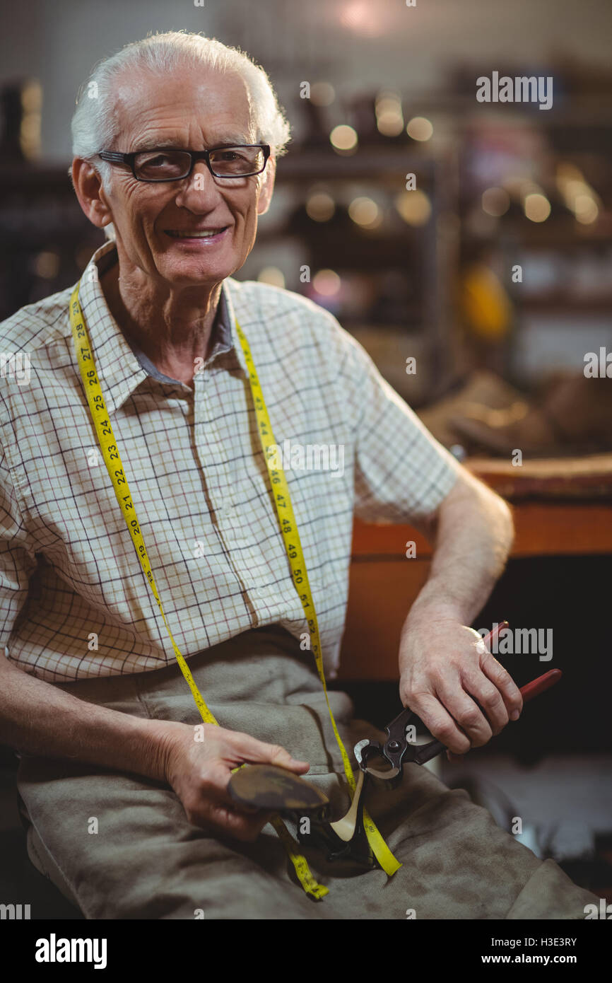 Happy shoemaker smiling camera making hi-res stock photography and ...