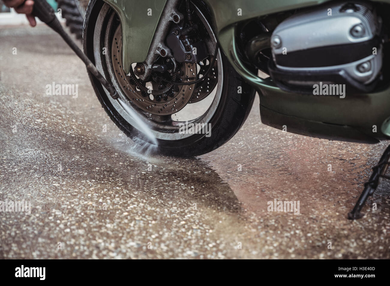 Motorcycle washing at workshop Stock Photo - Alamy