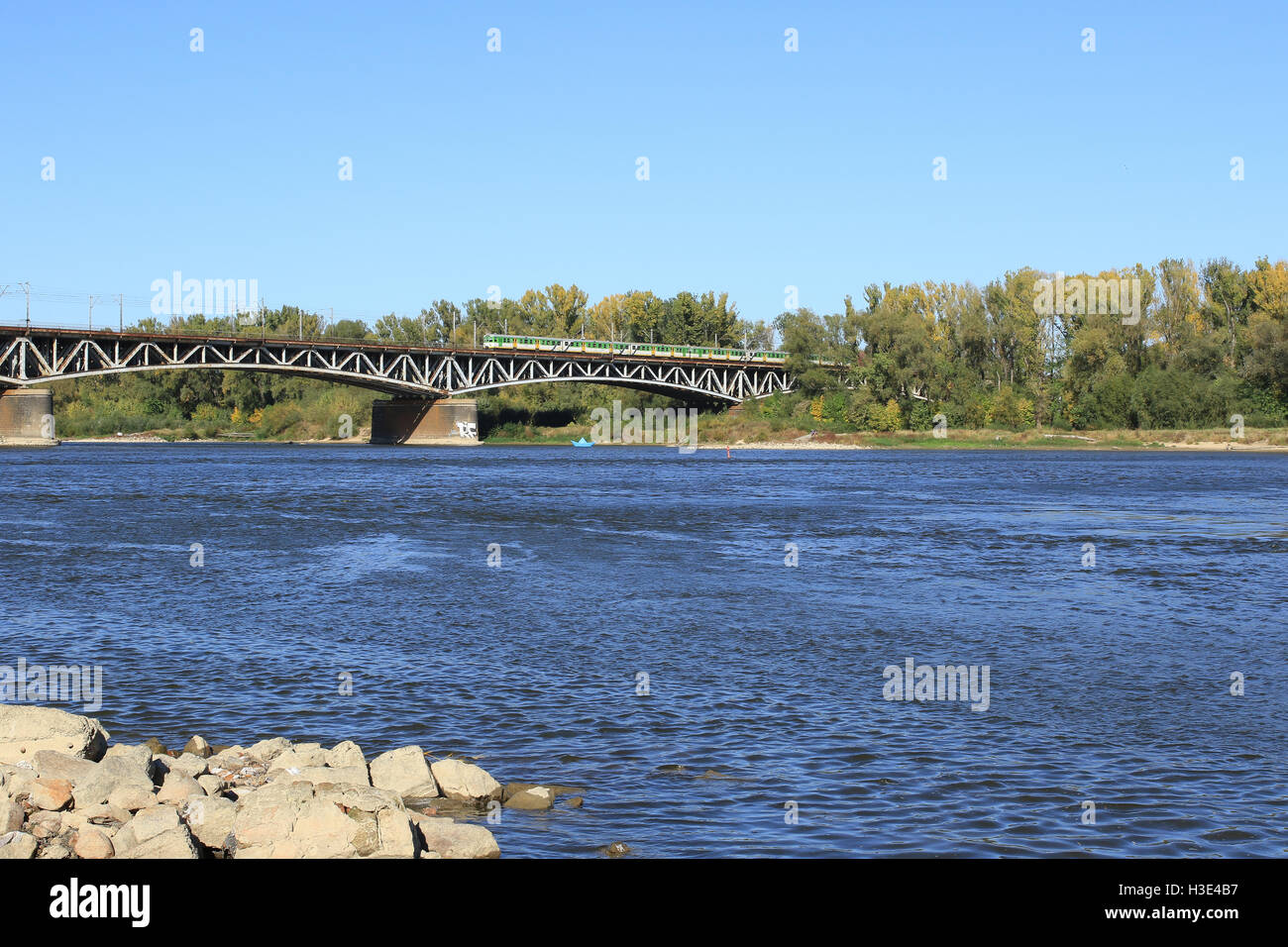 Railway bridge across the Vistula river with train, Warsaw Stock Photo ...