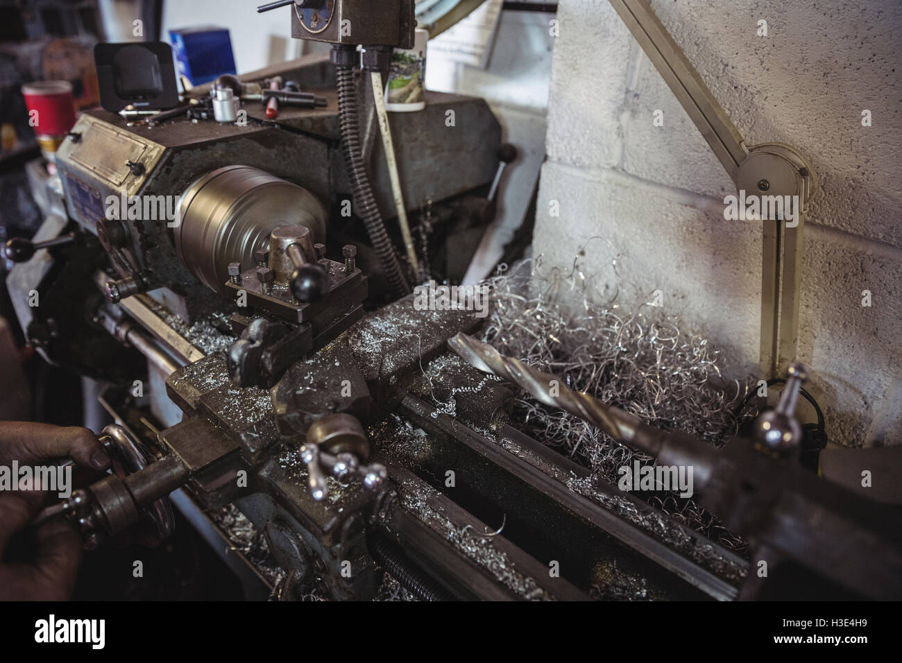 Mechanic working on a lathe machine Stock Photo - Alamy