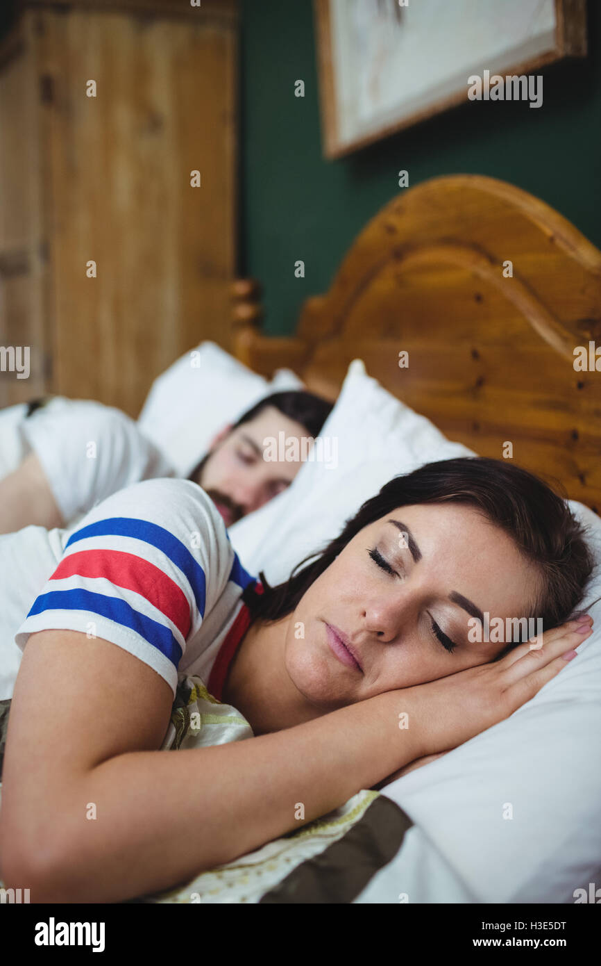 Couple sleeping together on bed Stock Photo - Alamy