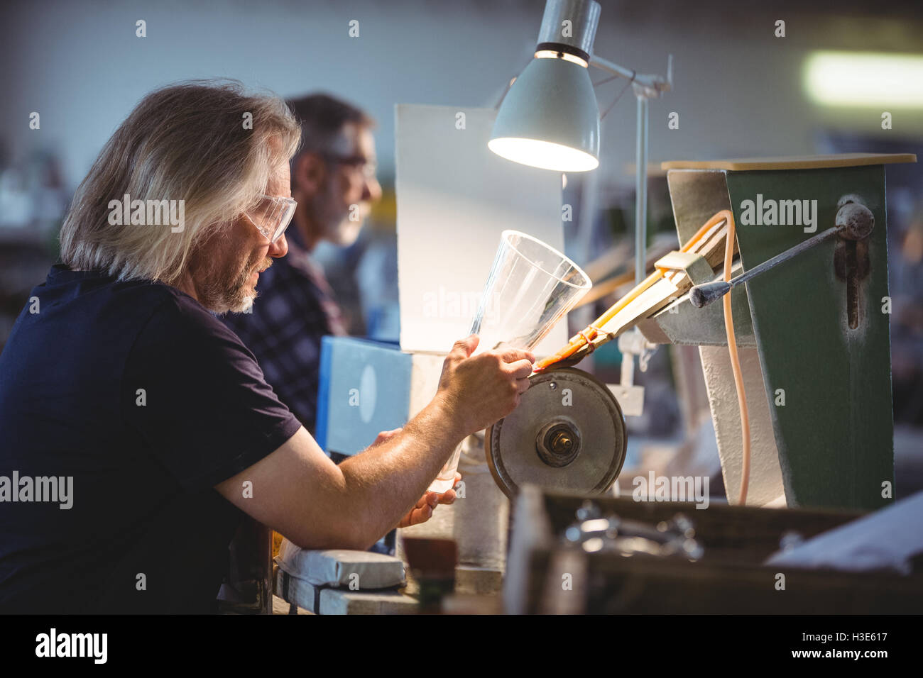 Glassblowers working on a glass Stock Photo - Alamy
