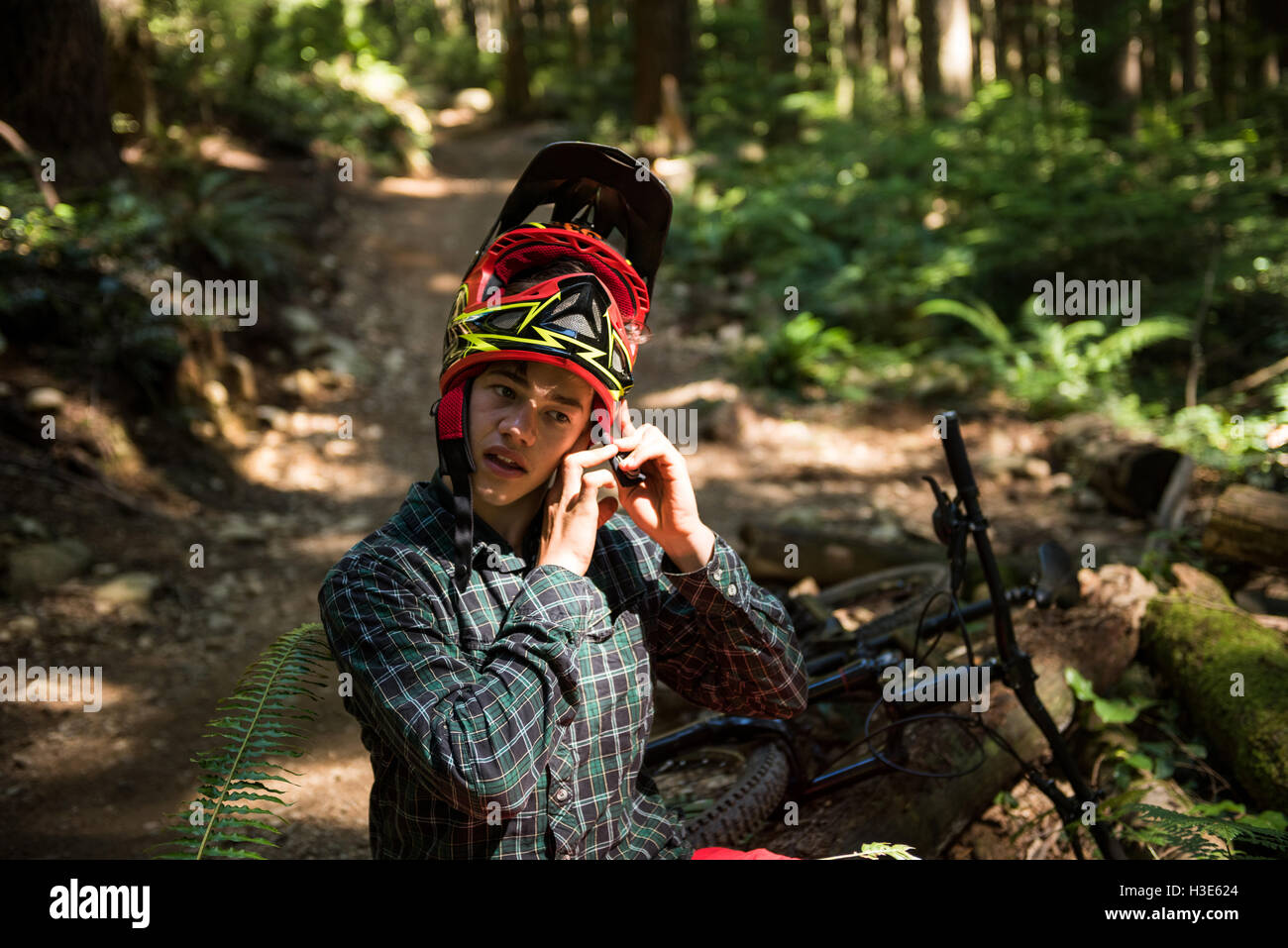 Teenager male with bicycle and helmet hi-res stock photography and ...