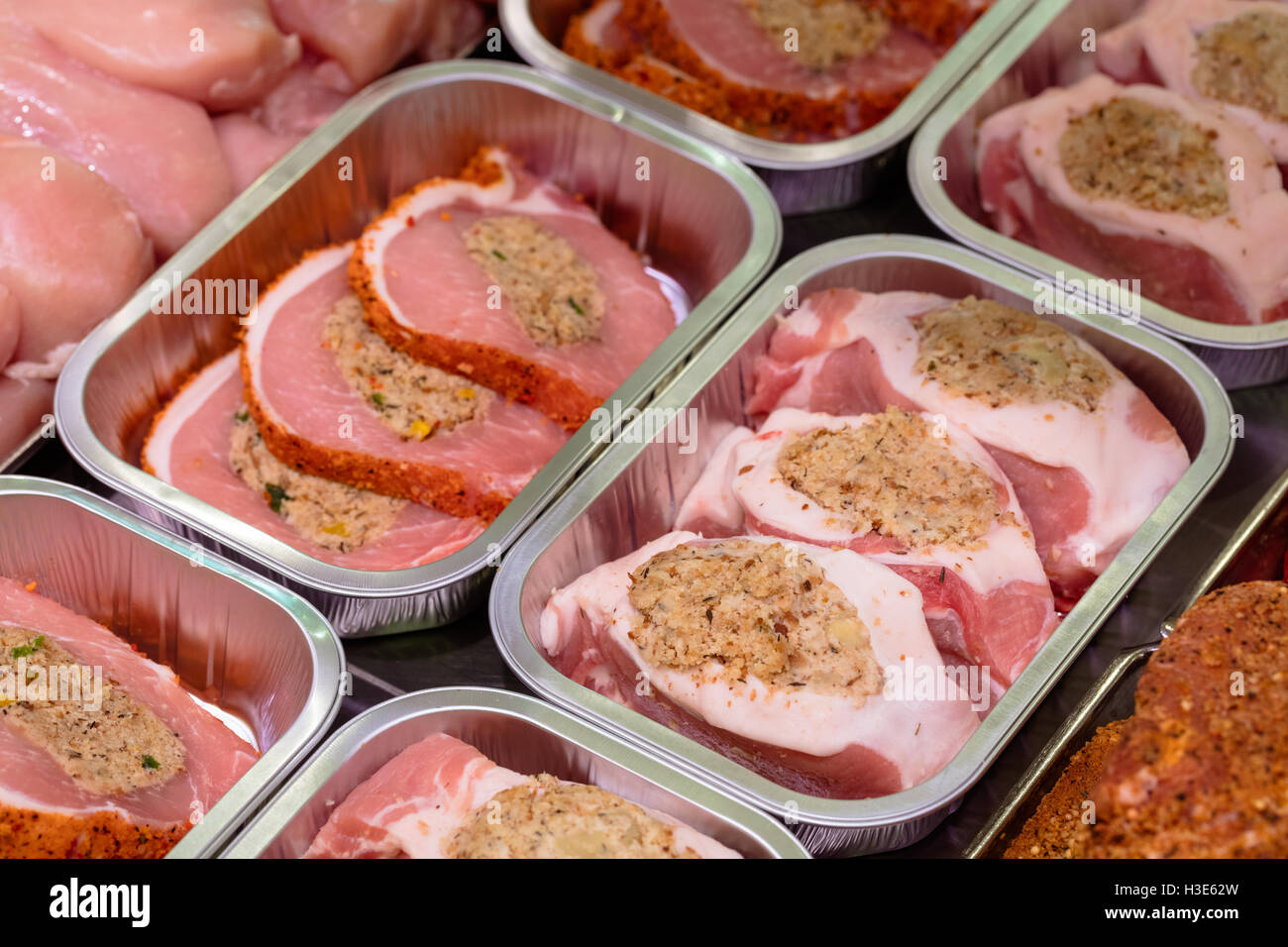 Close-up of marinated meat at display counter Stock Photo - Alamy